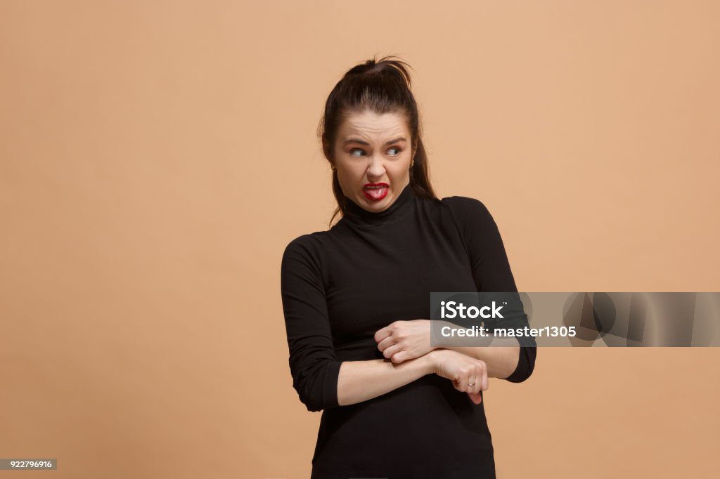 Young Woman With Disgusted Expression Repulsing Something Isolated On