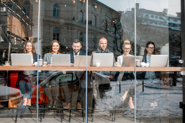Free Stock Photo of Group of People Sitting at a Table by a Window ...