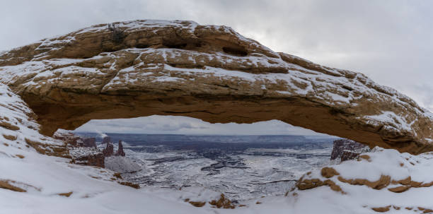 Free Stock Photo of Snowy arch overlooking a rugged canyon view ...
