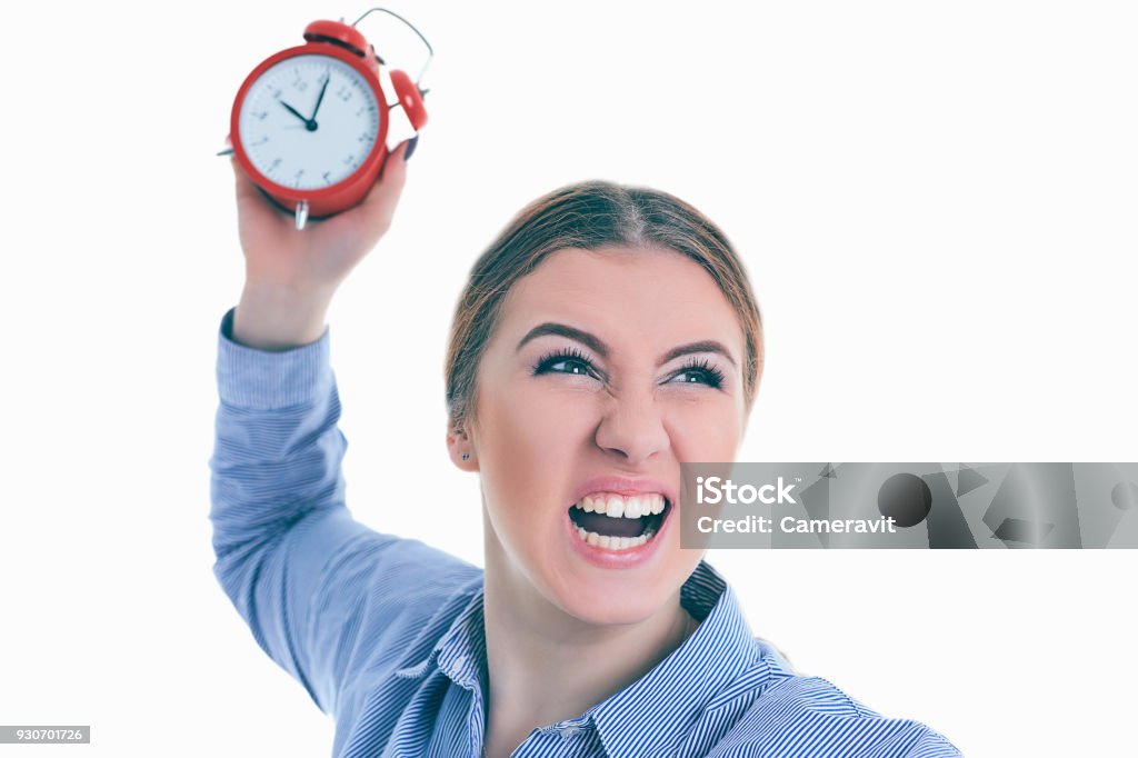 Angry Young Caucasian Woman Throwing An Alarm Clock Isolated In White ... Angry Young Caucasian Woman Throwing An Alarm Clock Isolated In White ...