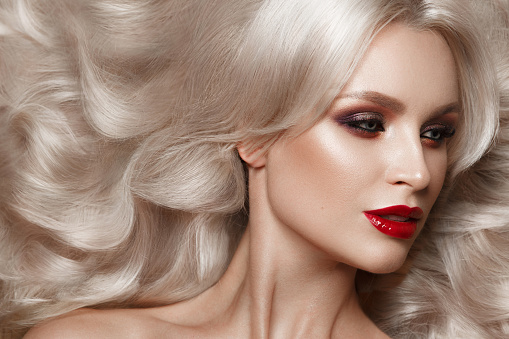 Beautiful Blonde In A Hollywood Manner With Curls Natural Makeup And