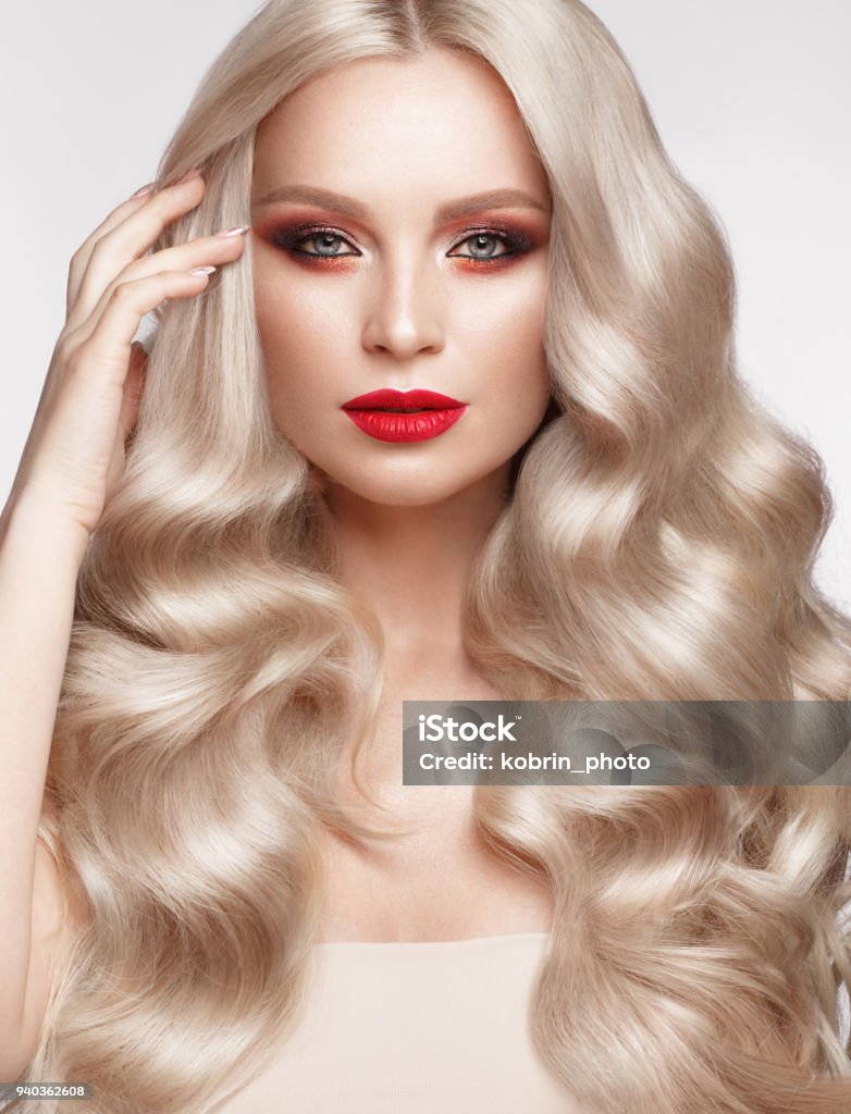 Beautiful Blonde In A Hollywood Manner With Curls Natural Makeup And