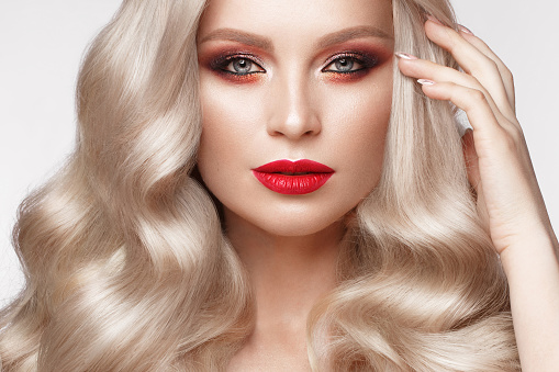 Beautiful Blonde In A Hollywood Manner With Curls Natural Makeup And
