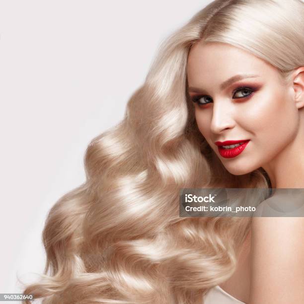Beautiful Blonde In A Hollywood Manner With Curls Natural Makeup And