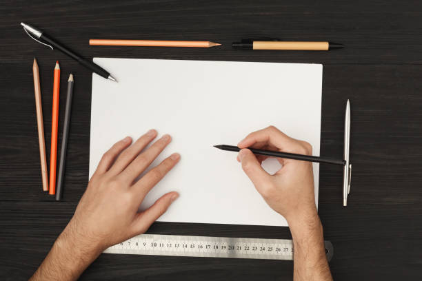 Free Stock Photo of Overhead view of a hand drawing art in a notebook ...
