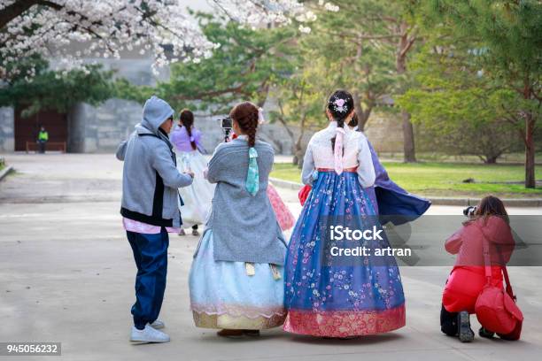 Asian Korean Woman Dressed Hanbok In Traditional Dress Walking In