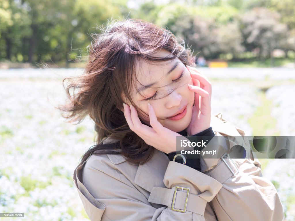 Beautiful Young Brunette Woman Hands On Chins And Enjoying The Wind In