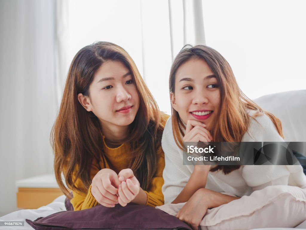 Young Asian Woman Lesbian Couple Smiling Happiness On The Bed At Home