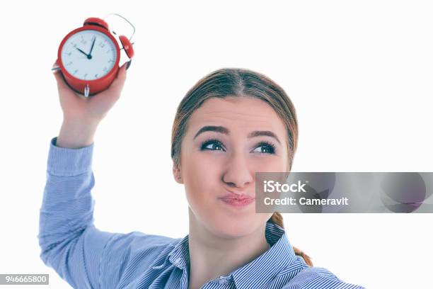 Angry Young Caucasian Woman Throwing An Alarm Clock Isolated In White ... Angry Young Caucasian Woman Throwing An Alarm Clock Isolated In White ...