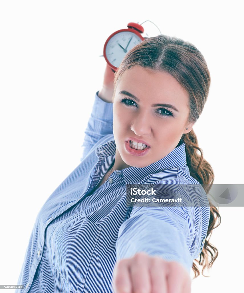Angry Young Caucasian Woman Throwing An Alarm Clock Isolated In White ... Angry Young Caucasian Woman Throwing An Alarm Clock Isolated In White ...