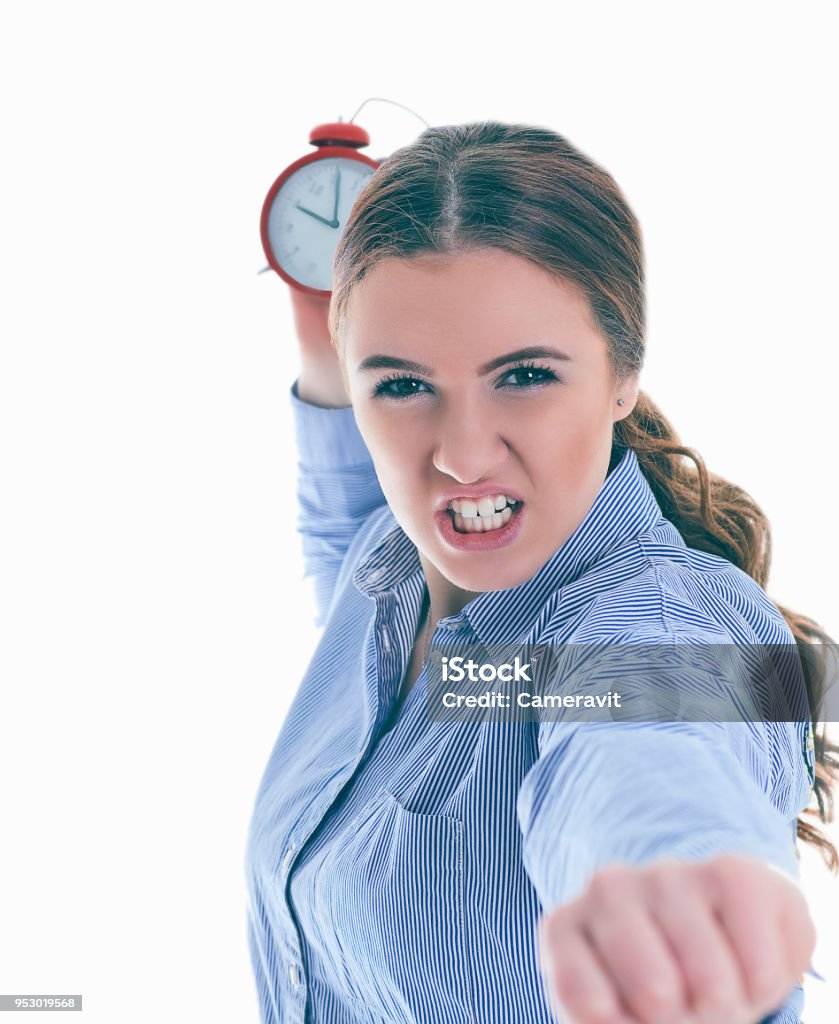 Angry Young Caucasian Woman Throwing An Alarm Clock Isolated In White ... Angry Young Caucasian Woman Throwing An Alarm Clock Isolated In White ...