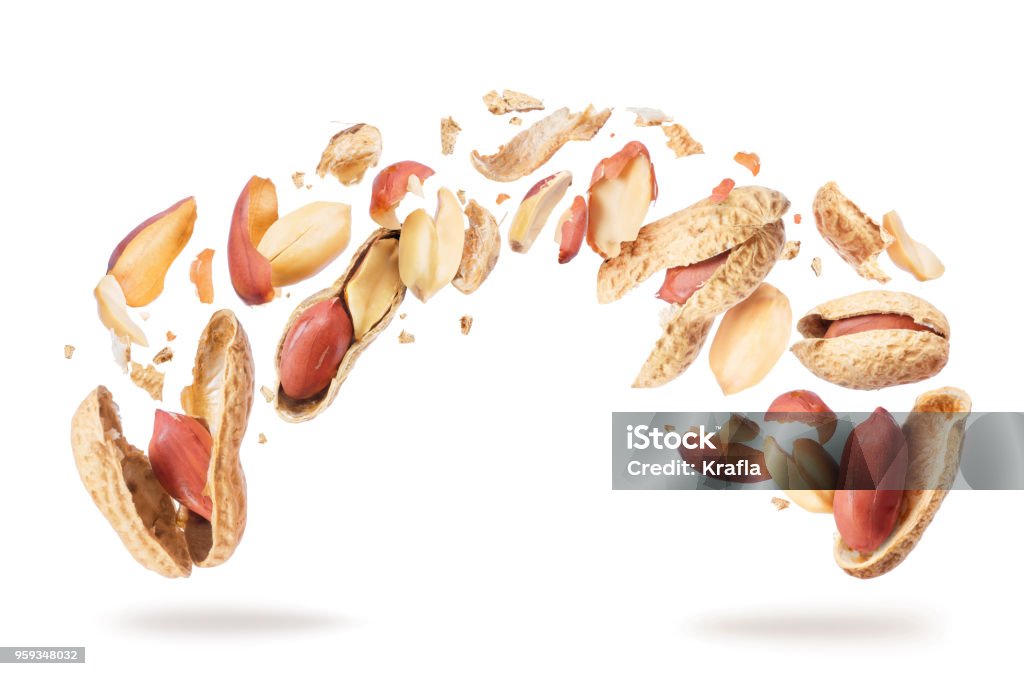Dried Peanuts Crushed Into Pieces Frozen In The Air On A White ... Dried Peanuts Crushed Into Pieces Frozen In The Air On A White ...