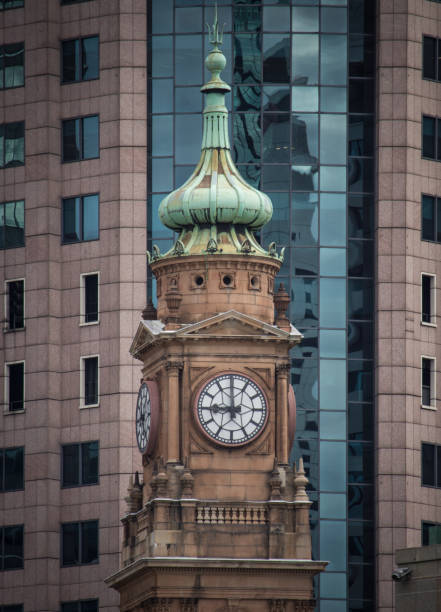 Free Stock Photo of Historic clock tower amidst modern buildings ...