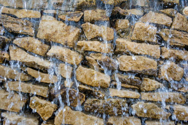 Free Stock Photo of Water flowing out of a stone wall | Download Free ...
