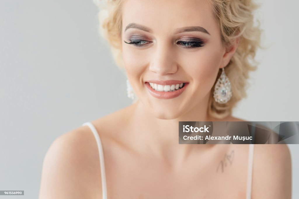 Beautiful Curly Hair Smiling Girl With Healthy Wavy Long Blonde Hair