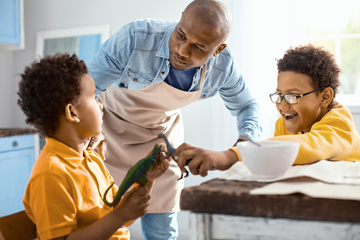 Caring Young Father Trying To Calm Down His Sons Stock Photo - Download ... Caring Young Father Trying To Calm Down His Sons Stock Photo - Download ...