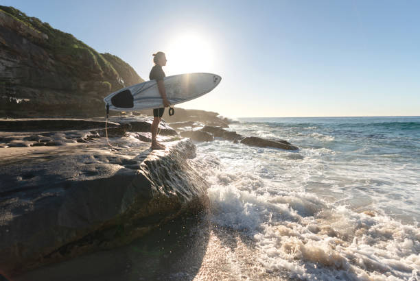 Free Stock Photo of Person Riding Surfboard on Rocky Beach | Download ...