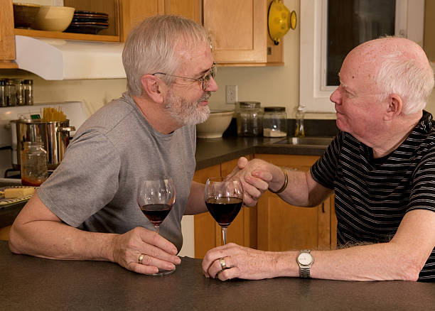 40 Mature Older Senior Gay Male Couple Smiling And Affectionate Stock