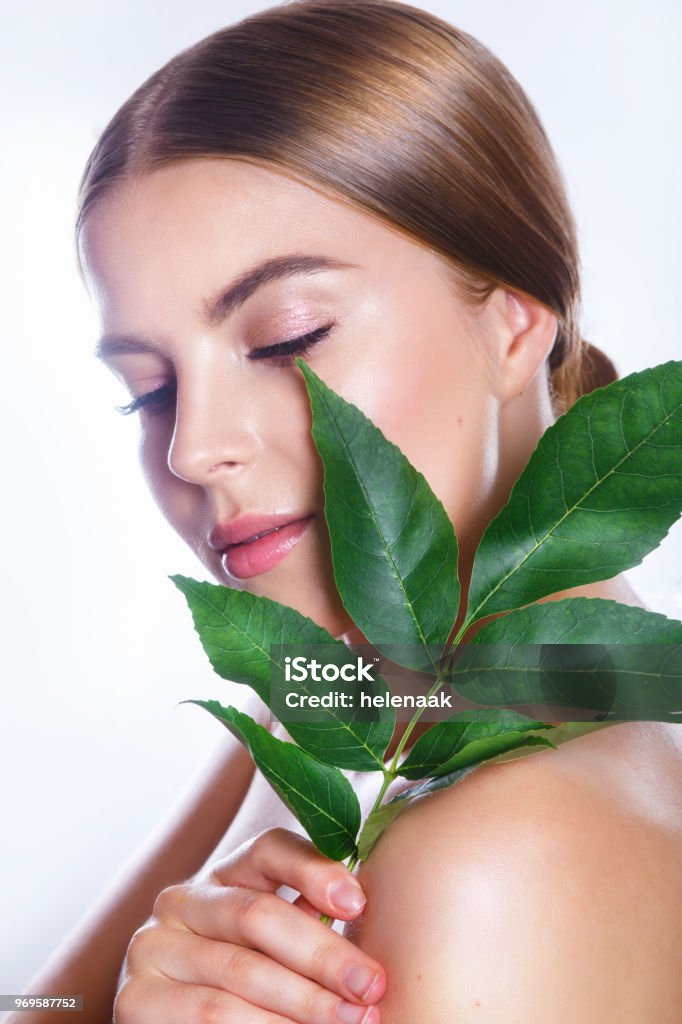 Beautiful Woman Face Portrait With Green Leaf Concept For Skin Care Or