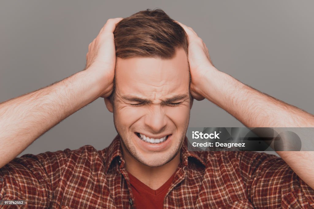 Handsome Depressed Young Man Holding His Head And Screaming Stock Photo ... Handsome Depressed Young Man Holding His Head And Screaming Stock Photo ...
