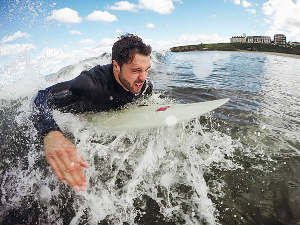 Surfer Paddling Out Stock Photos, Pictures & Royalty-Free Images - iStock Surfer Paddling Out Stock Photos, Pictures & Royalty-Free Images - iStock