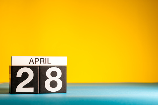 April 28th Day 28 Of April Month Calendar On Table With Yellow ... April 28th Day 28 Of April Month Calendar On Table With Yellow ...