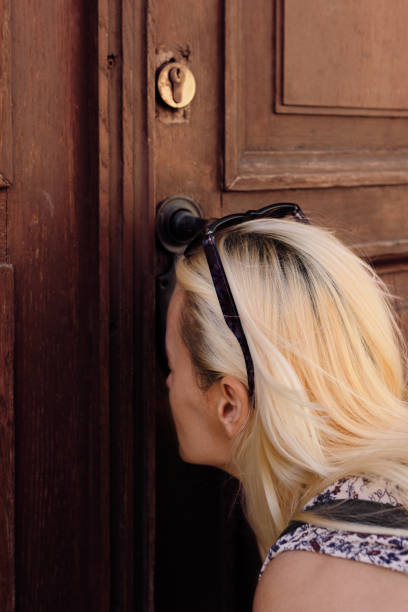 Royalty Free Woman Spying Through A Keyhole Pictures, Images and Stock ... Royalty Free Woman Spying Through A Keyhole Pictures, Images and Stock ...