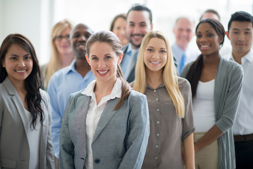 Business Professionals Standing Together At Work Stock Photo - Download ... Business Professionals Standing Together At Work Stock Photo - Download ...