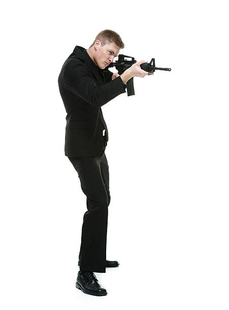 Royalty Free Man Pointing Gun Suit Full Body Pictures, Images and Stock ... Royalty Free Man Pointing Gun Suit Full Body Pictures, Images and Stock ...