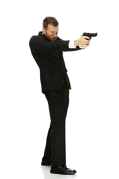 Royalty Free Man Pointing Gun Suit Full Body Pictures, Images and Stock ... Royalty Free Man Pointing Gun Suit Full Body Pictures, Images and Stock ...