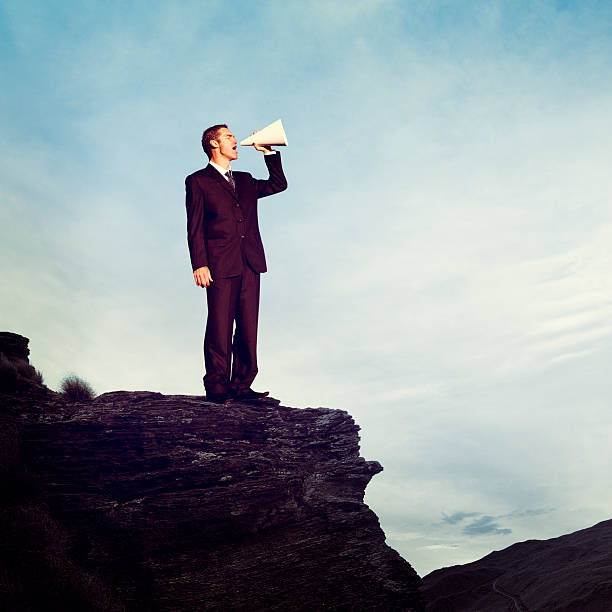 Businessman Shouting By Mountains Stock Photos, Pictures & Royalty-Free ... Businessman Shouting By Mountains Stock Photos, Pictures & Royalty-Free ...