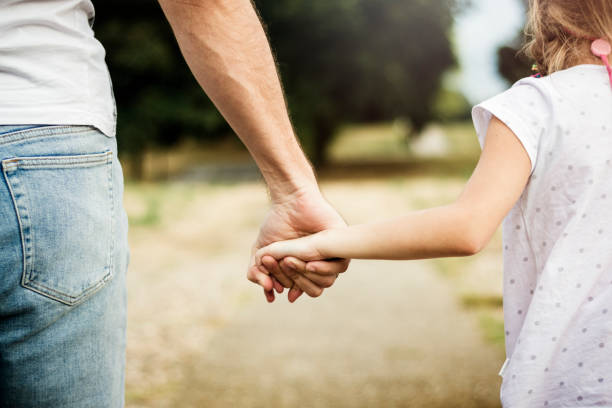Best Parent And Child Holding Hands Stock Photos, Pictures & Royalty ... Best Parent And Child Holding Hands Stock Photos, Pictures & Royalty ...
