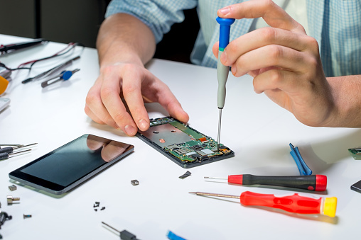 Fixing Mobile Phone Stock Photo - Download Image Now - iStock Fixing Mobile Phone Stock Photo - Download Image Now - iStock