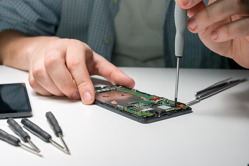 Fixing Mobile Phone Stock Photo - Download Image Now - iStock Fixing Mobile Phone Stock Photo - Download Image Now - iStock