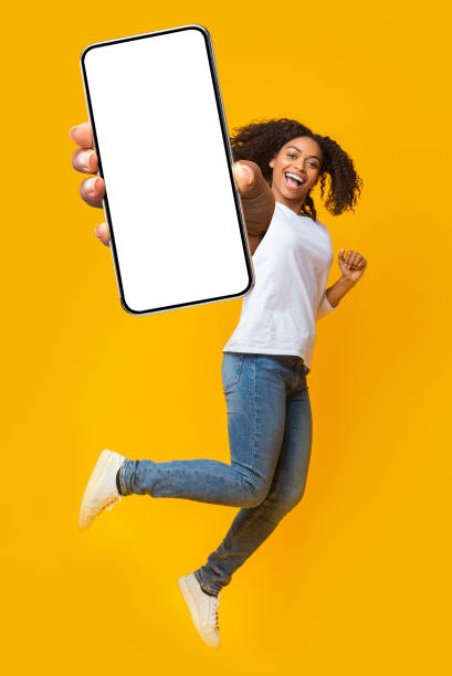 Excited Black Woman Holding Phone Stock Photos, Pictures & Royalty-Free ... Excited Black Woman Holding Phone Stock Photos, Pictures & Royalty-Free ...
