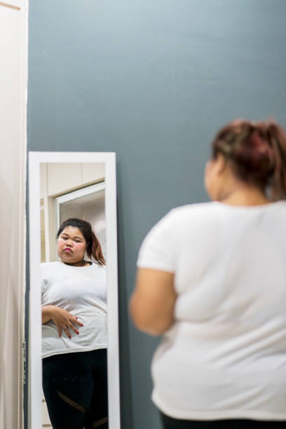Best Fat Woman Looking In Mirror Stock Photos, Pictures & Royalty-Free ... Best Fat Woman Looking In Mirror Stock Photos, Pictures & Royalty-Free ...