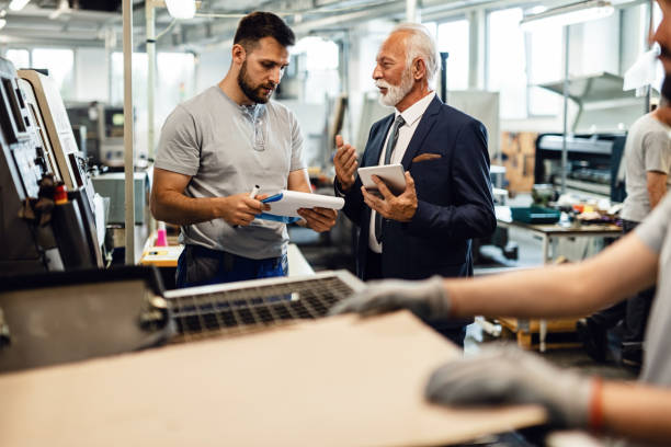 Industrial Workers Talking Stock Photos, Pictures & Royalty-Free Images ... Industrial Workers Talking Stock Photos, Pictures & Royalty-Free Images ...