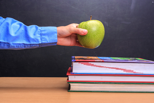 Student Gives Teacher An Apple Stock Photo - Download Image Now - iStock Student Gives Teacher An Apple Stock Photo - Download Image Now - iStock