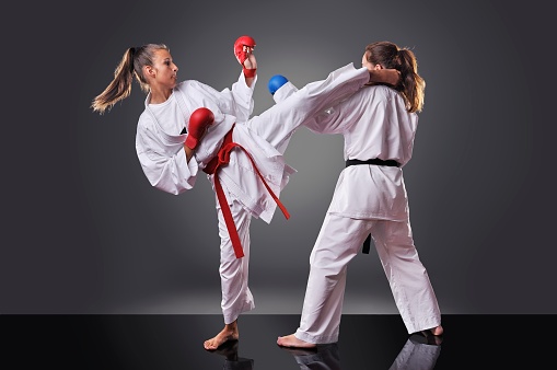 Two Female Young Karate Fighting On The Gray Background Stock Photo ... Two Female Young Karate Fighting On The Gray Background Stock Photo ...