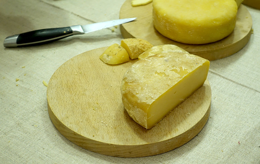 Whole And Notched Heads Of Different Kinds Of Cheese Stock Photo ... Whole And Notched Heads Of Different Kinds Of Cheese Stock Photo ...